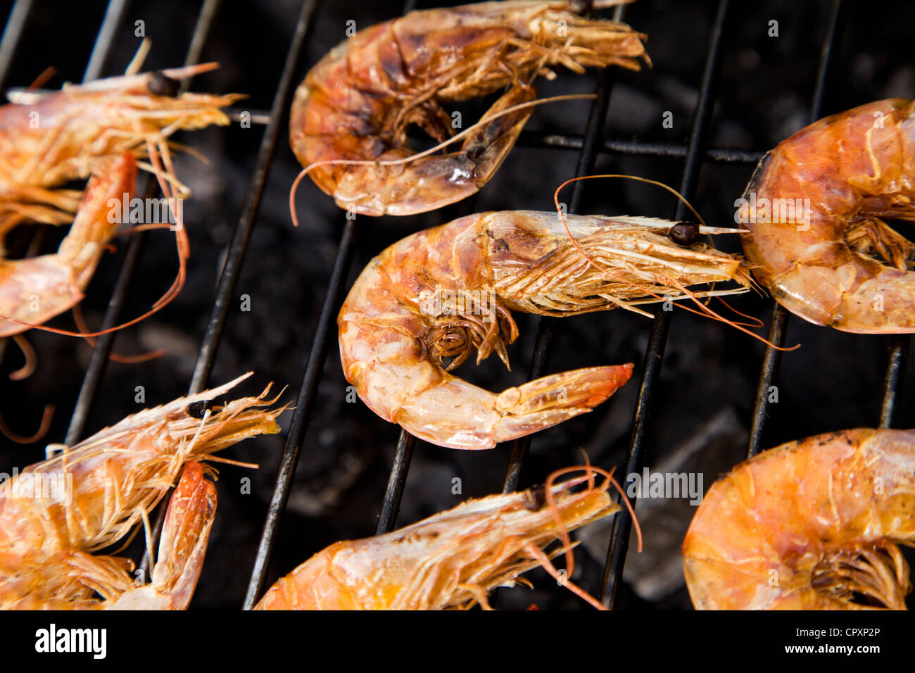 Seafood on grill. Fish and shrimps Stock Photo - Alamy