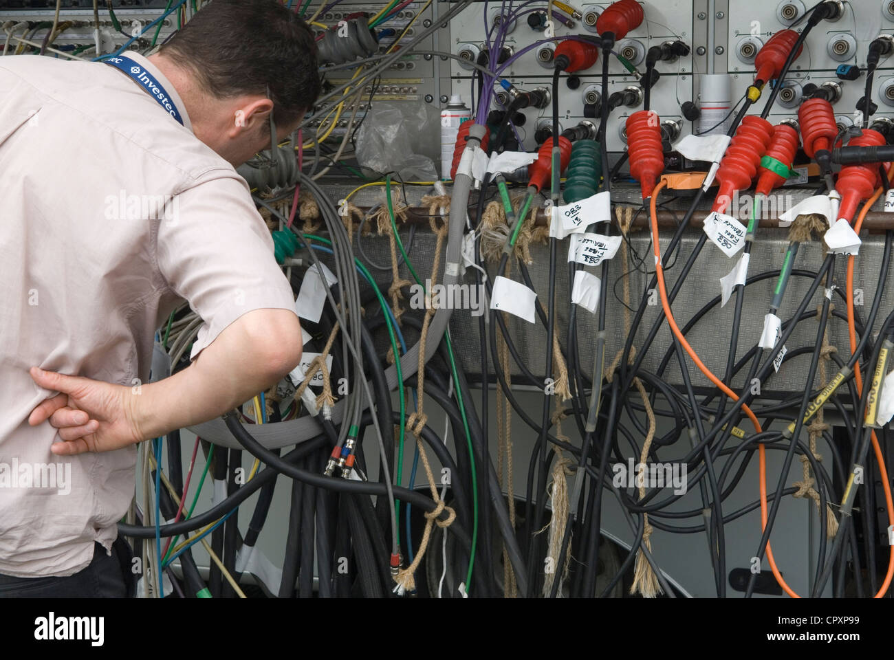 Man looking at cables for outside broadcast van HOMER SYKES Stock Photo ...
