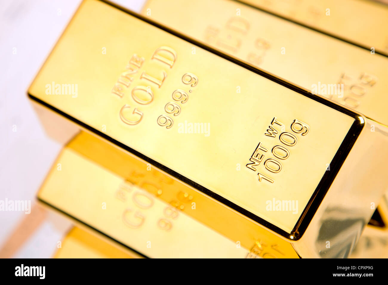 Gold bars on graphs and statistics Stock Photo - Alamy