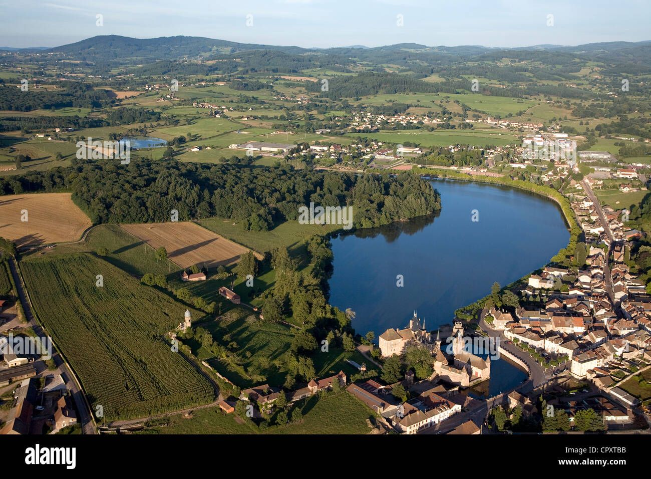 France, Saone-et-Loire, castle and lake of village of La Clayette ...