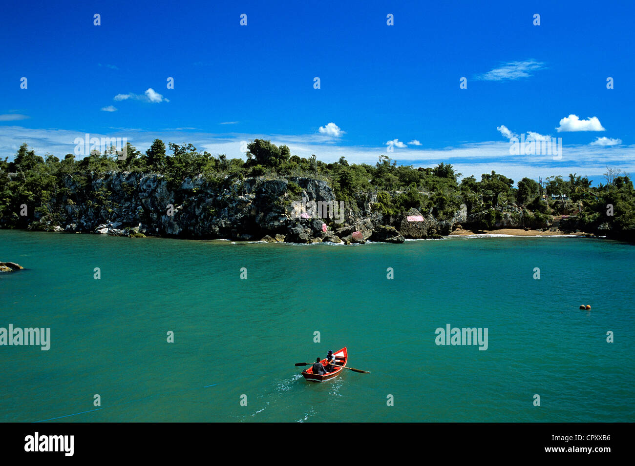 Dominican Republic, Altagracia province, Boca de Yuma, a small boat ...
