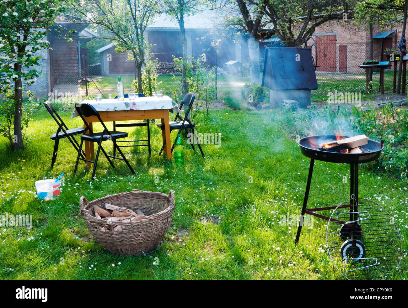 Old-fashioned barbecue in the countryside farm garden Stock Photo - Alamy