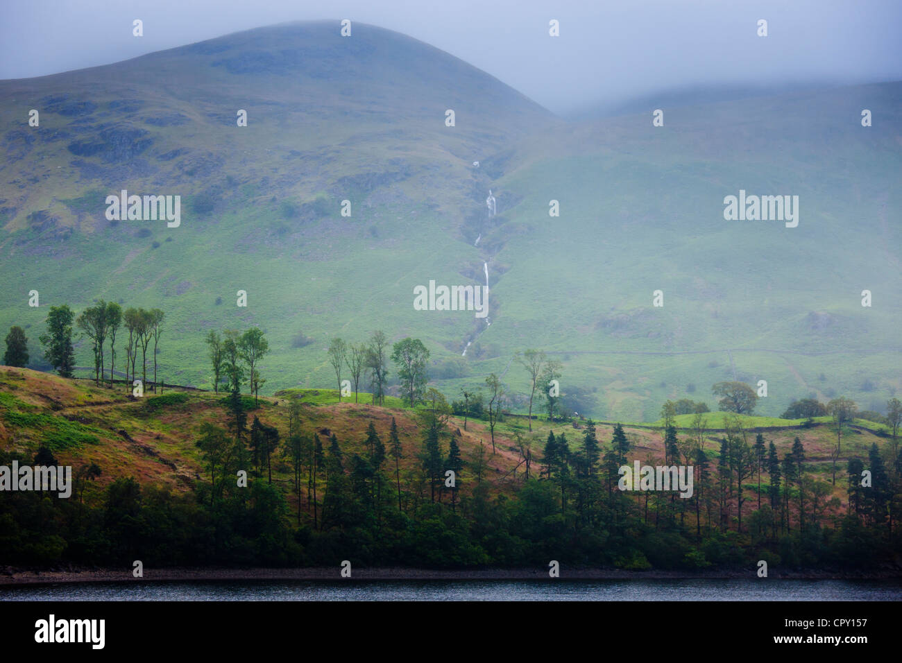 Mountain stream and Thirlmere Lake reservoir in the Lake District ...