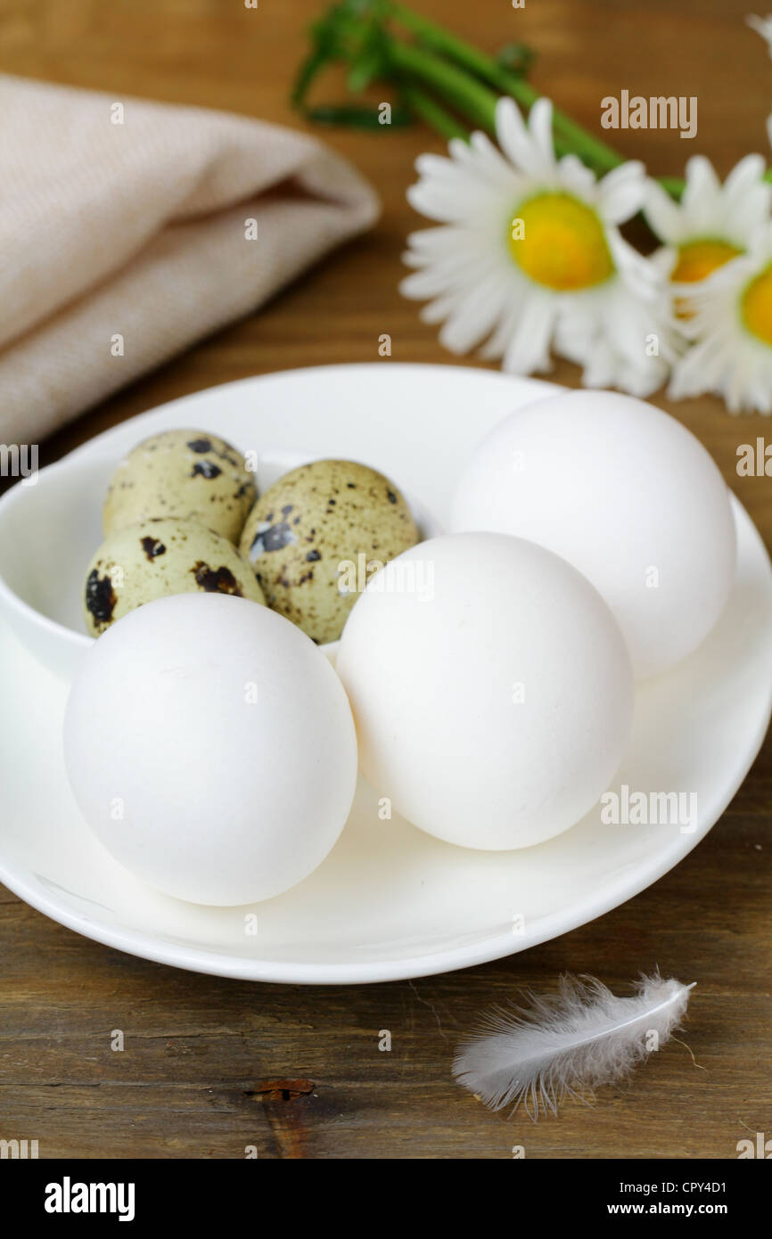 chicken and quail eggs , rustic style Stock Photo - Alamy