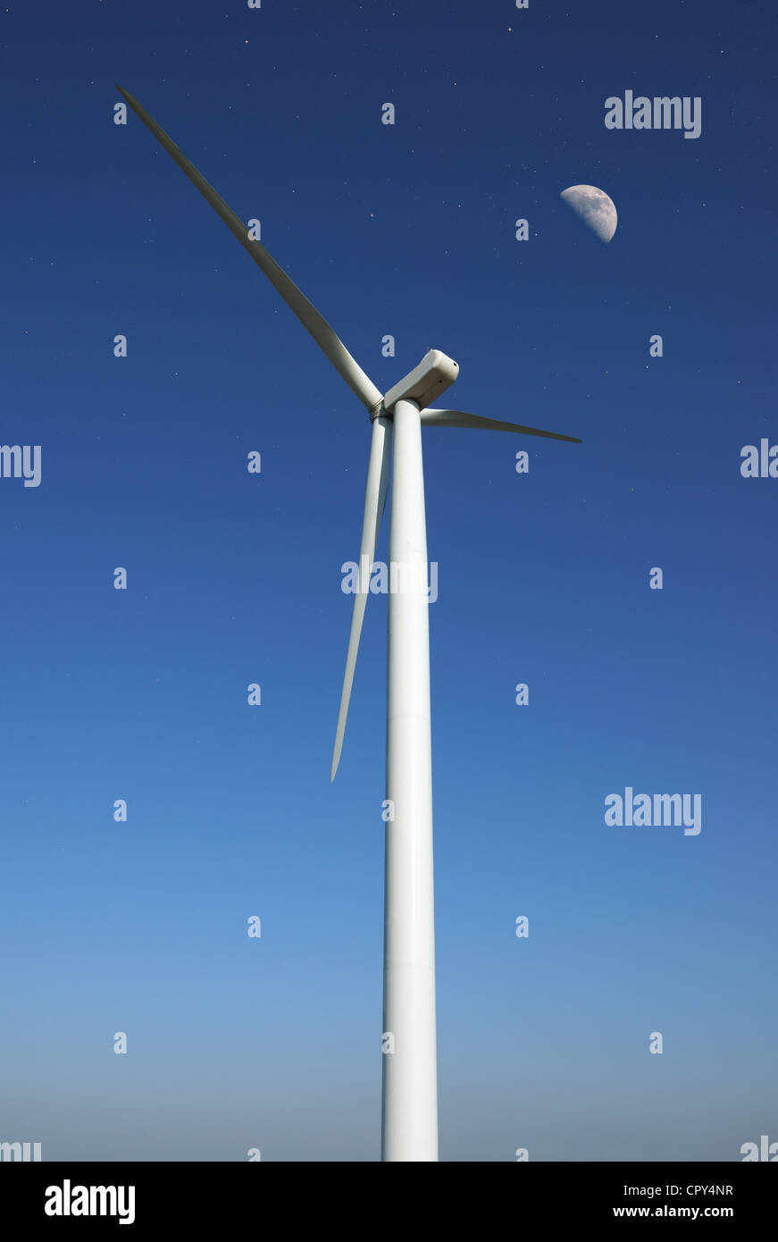 Wind turbine with half moon in background Stock Photo - Alamy