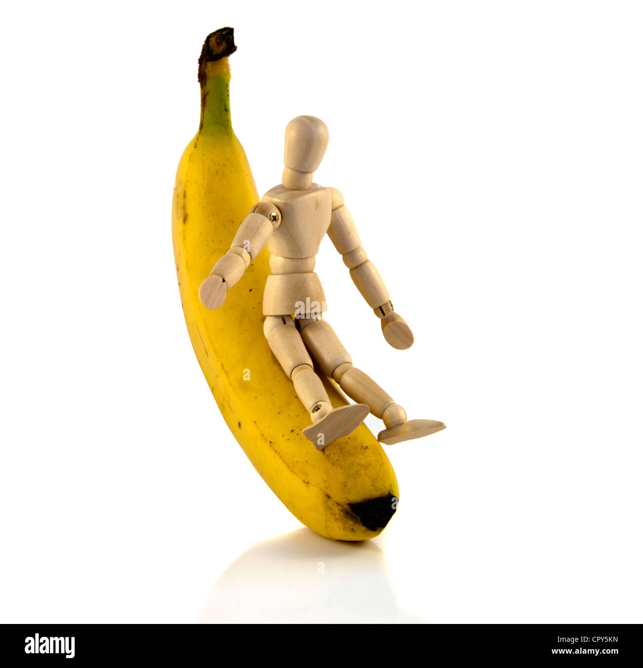 wooden puppet boy play with the banana Stock Photo - Alamy