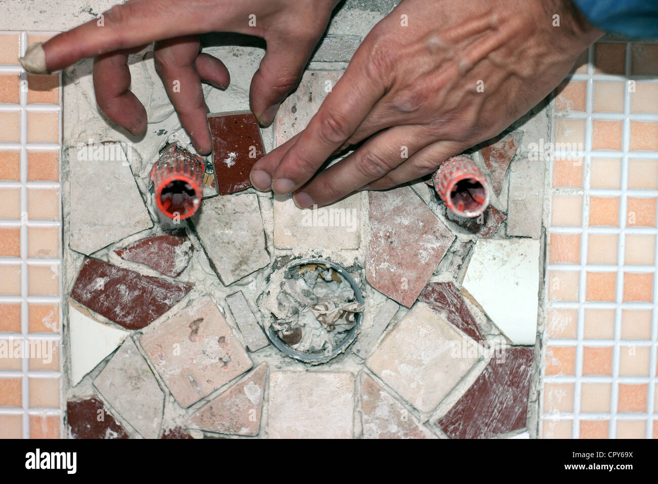 close up of hands installing a tile of mosaic Stock Photo - Alamy
