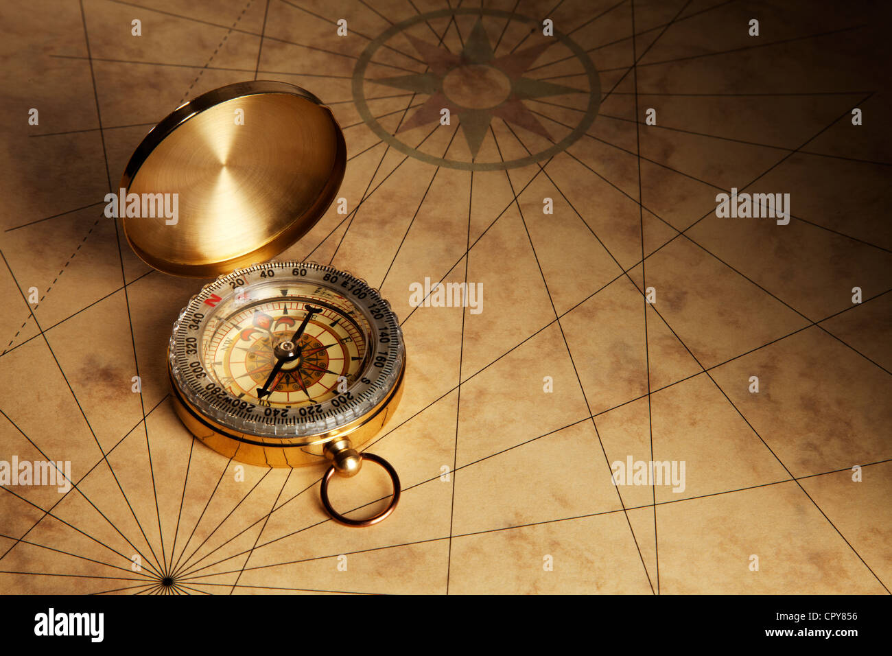 Close up view of the Compass on the old paper background Stock Photo ...
