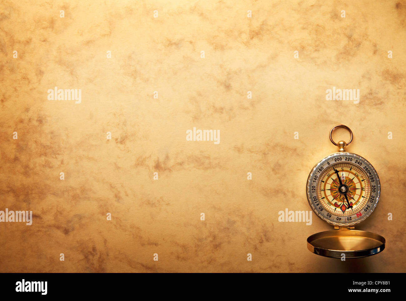 Close up view of the Compass on the old paper background Stock Photo ...