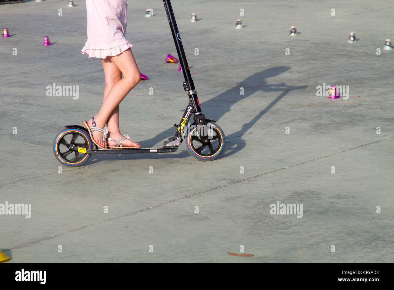 young girl riding scooter Stock Photo - Alamy