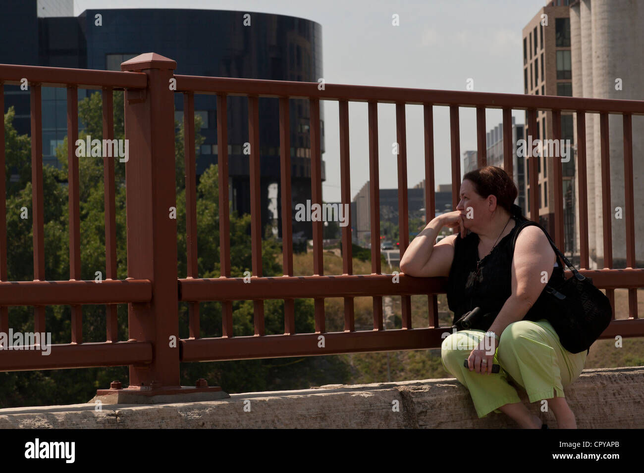 woman looking on at the rubble from the 35W bridge collapse Stock Photo ...
