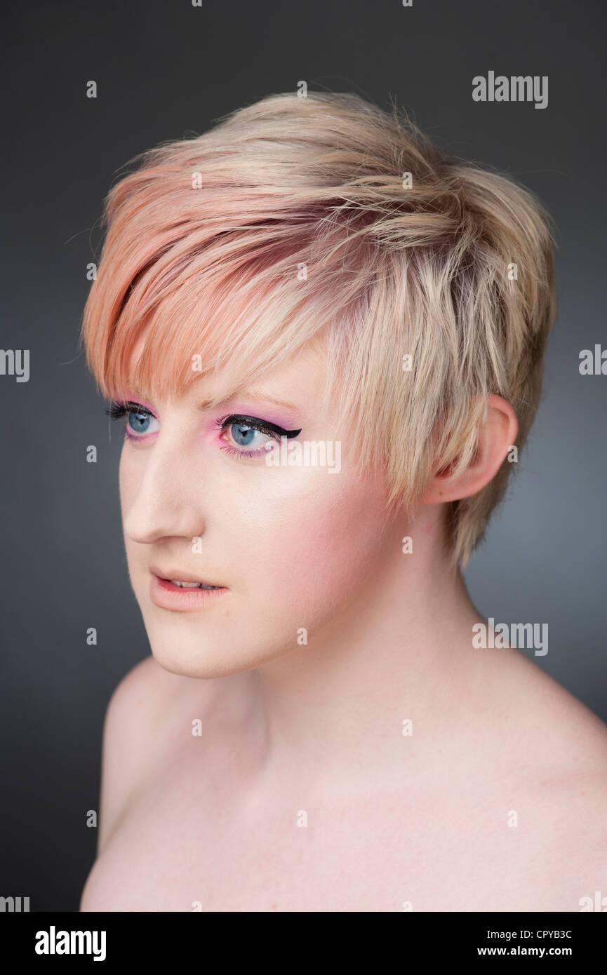 a woman girl person with a striking fashionable modern haircut hair ...