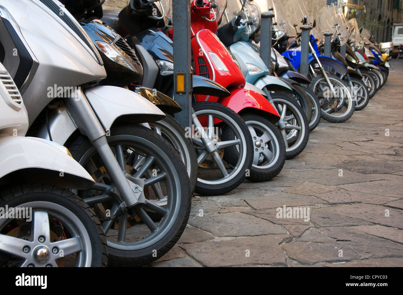 Line of different motorcycles on stone road Stock Photo - Alamy