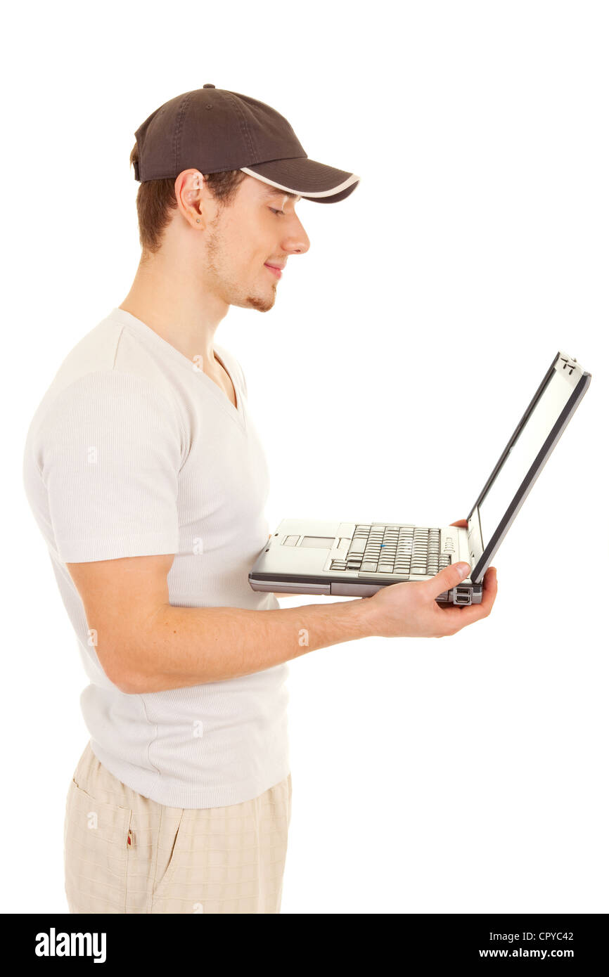 Handsome casual standing man with laptop on white background Stock ...
