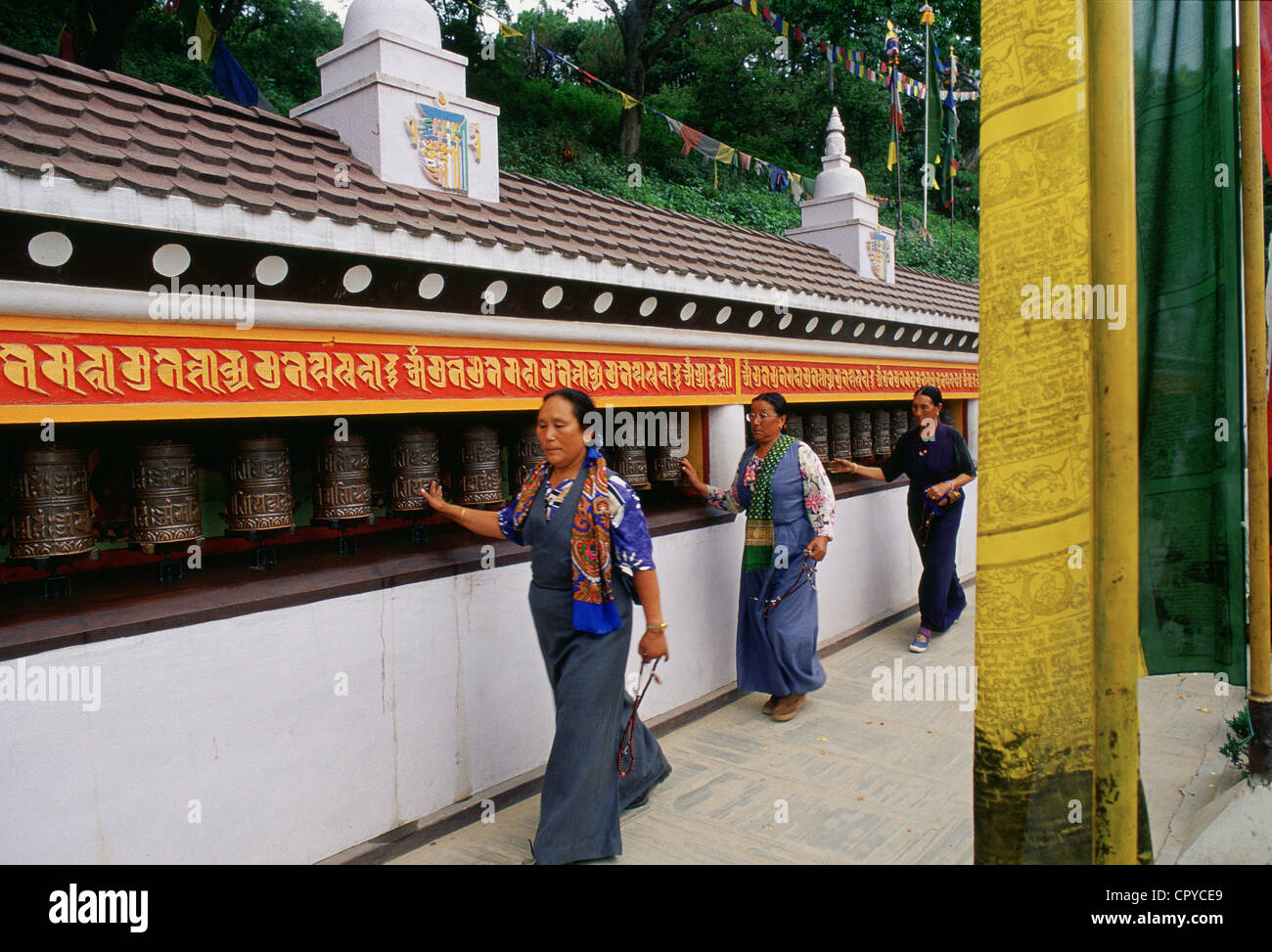 Tibetan women are circumambulating around the shrine of Swayambhunath ...