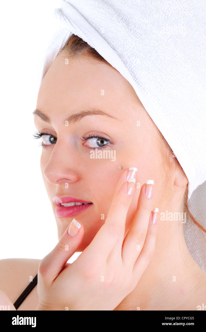 Woman appling cream hi-res stock photography and images - Alamy