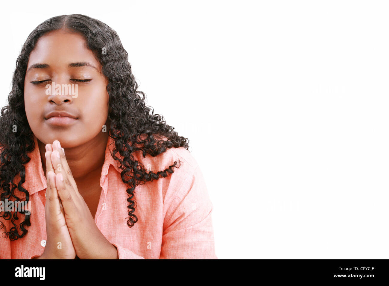 woman praying isolated on a white background Stock Photo - Alamy