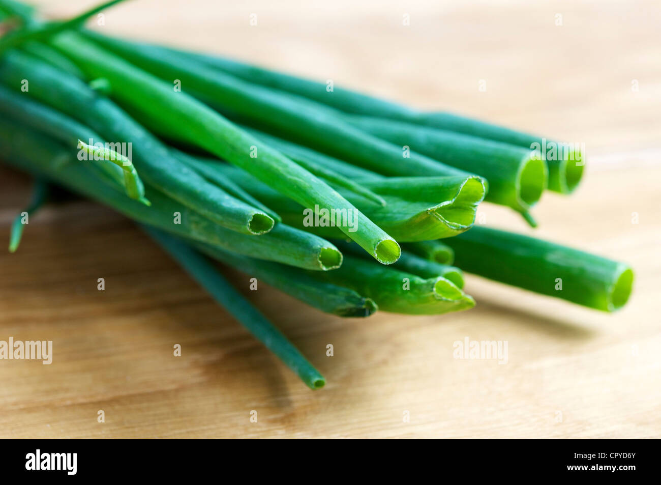 Fresh scallions tied into a bundle Stock Photo - Alamy