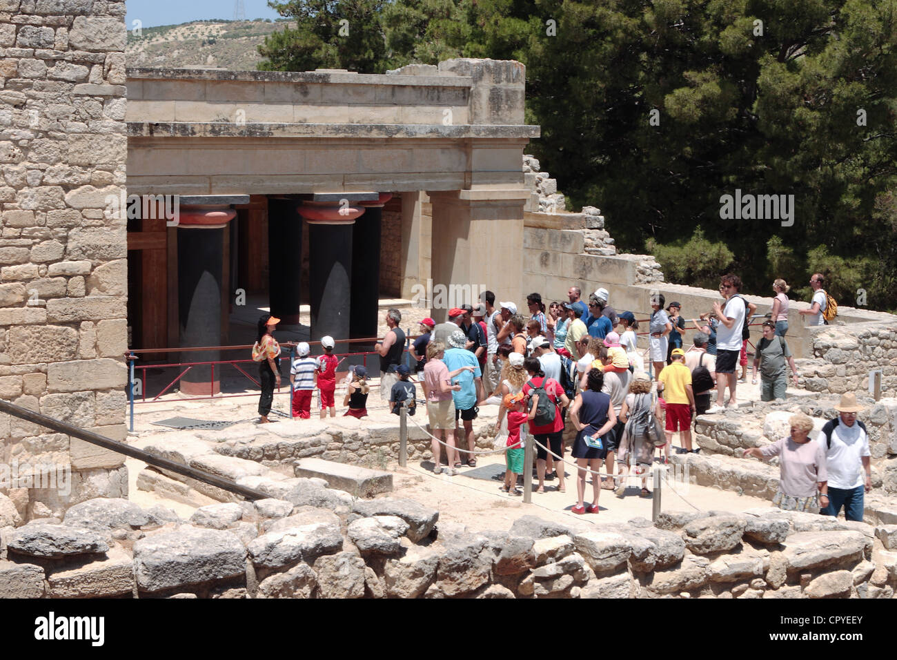 A party of tourists at the ancient Minoan archaeological site of ...