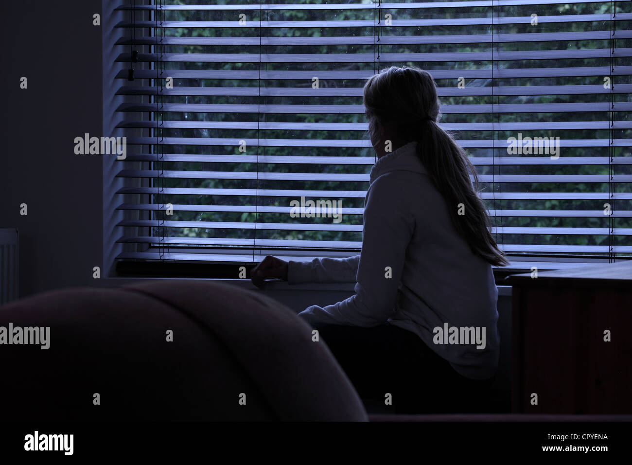Teen Girl Looking Out A Window High Resolution Stock Photography and ...