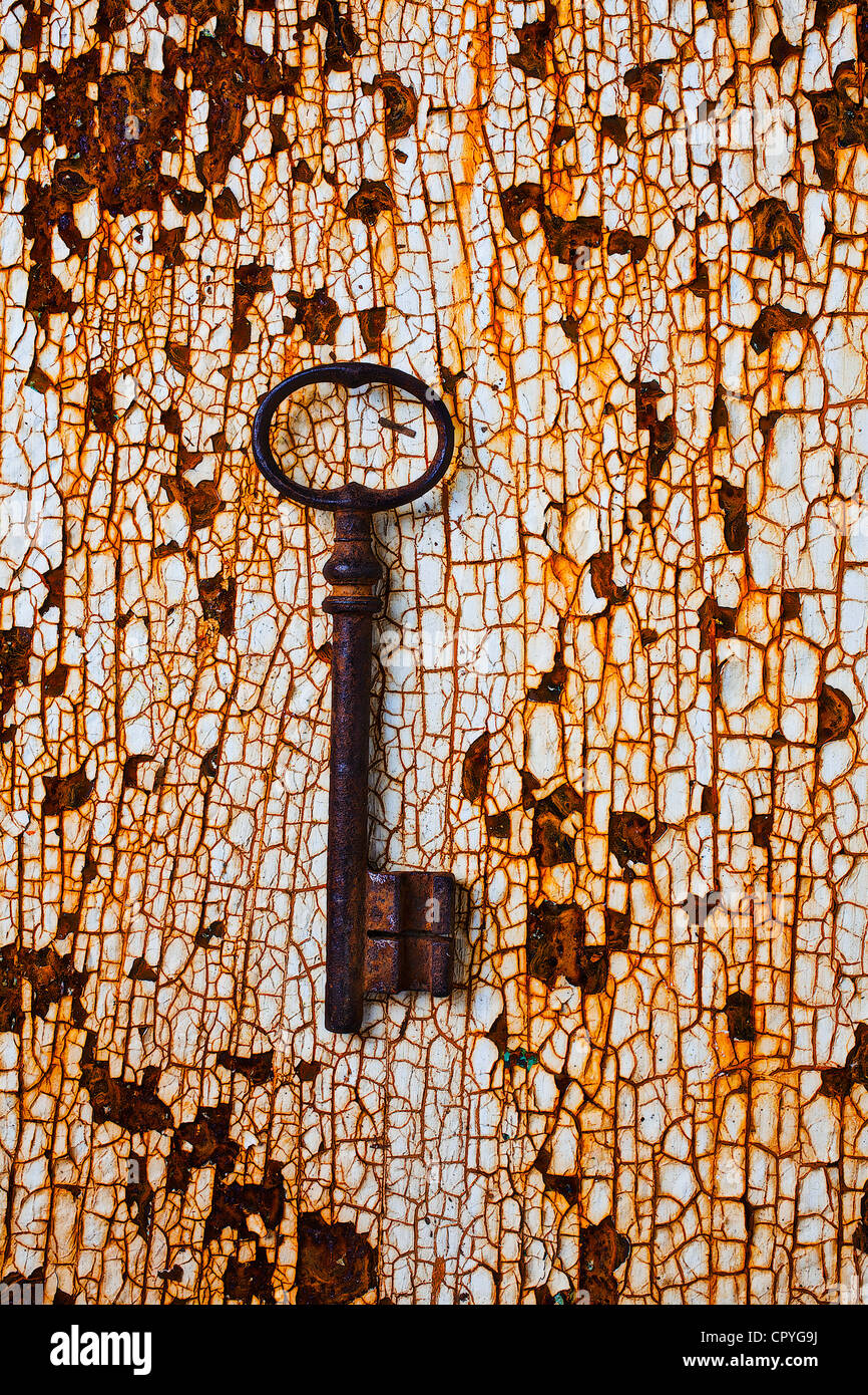 Rusty key on paint peeling table Stock Photo - Alamy