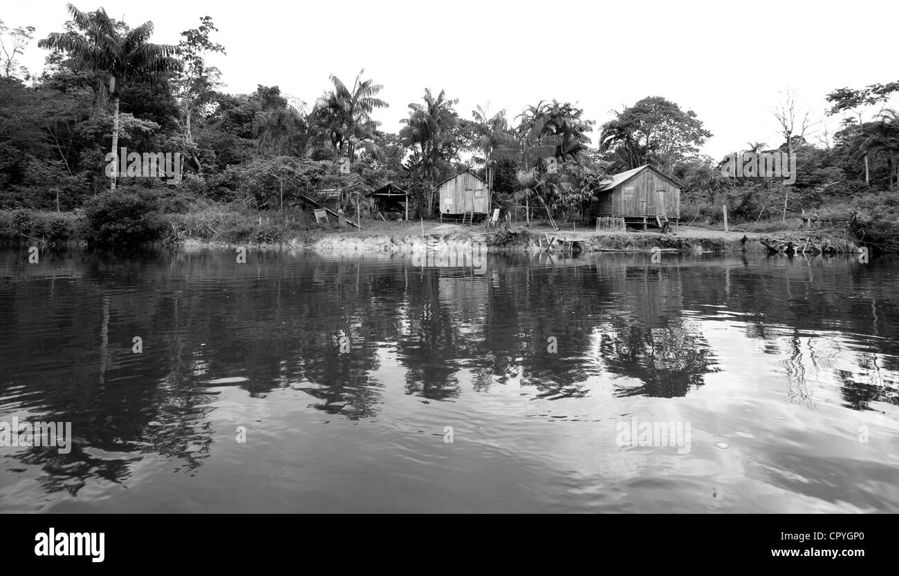 Shacks line the shores of th Amapari River, a tributary of the Amazon ...