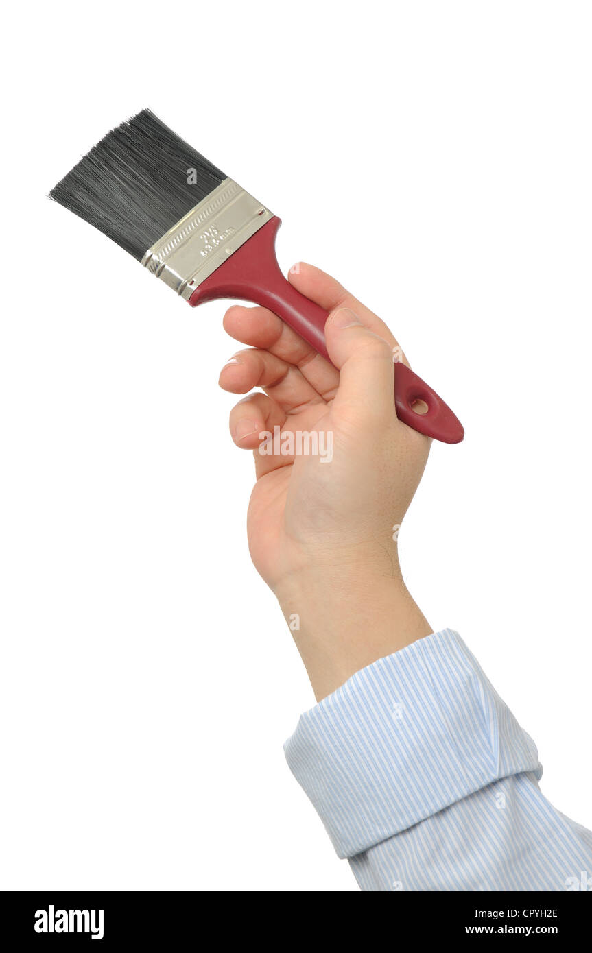 Hand holding paint brush Stock Photo - Alamy
