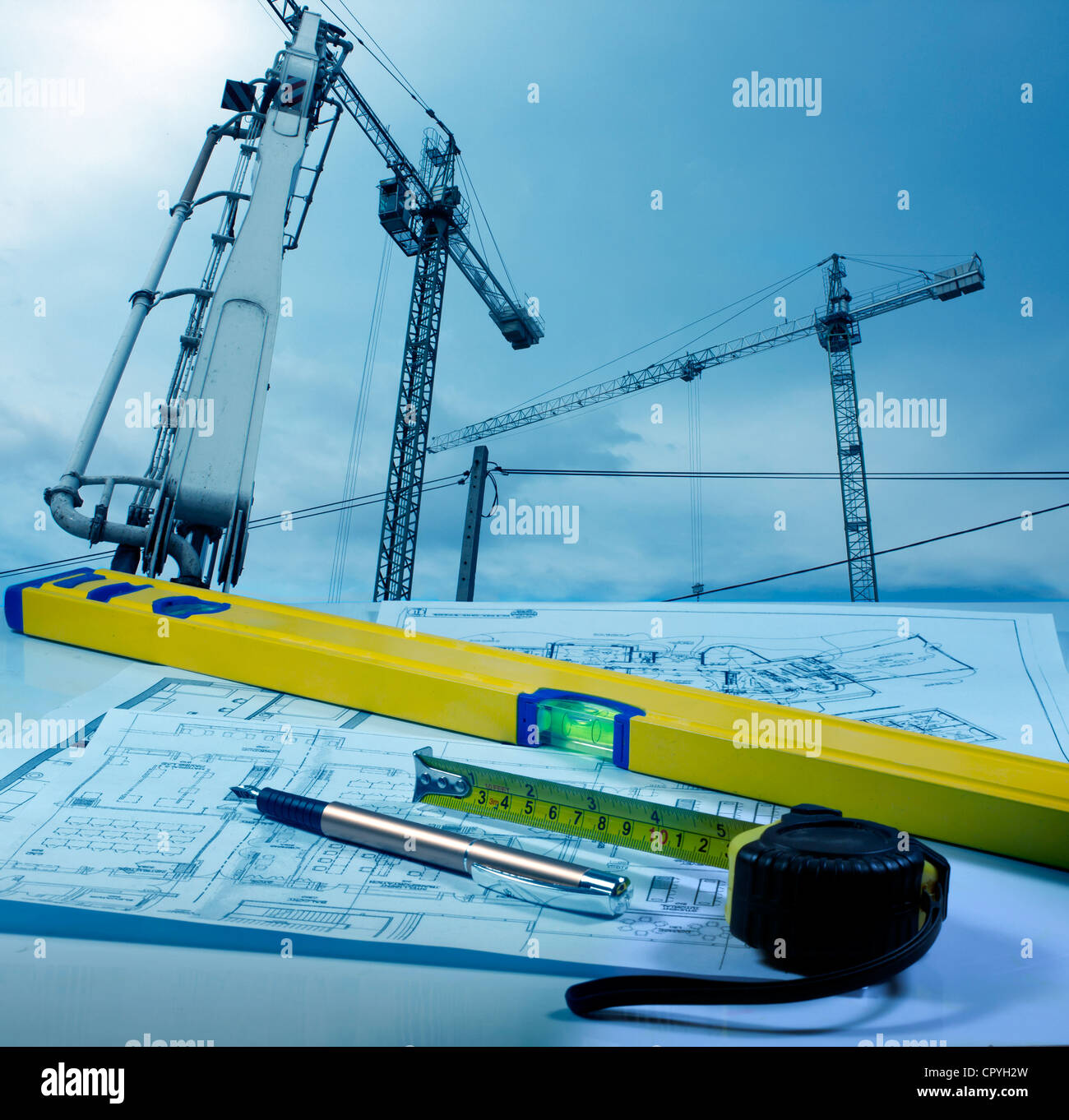 Construction blueprints, cranes, work place and plans concept Stock ...