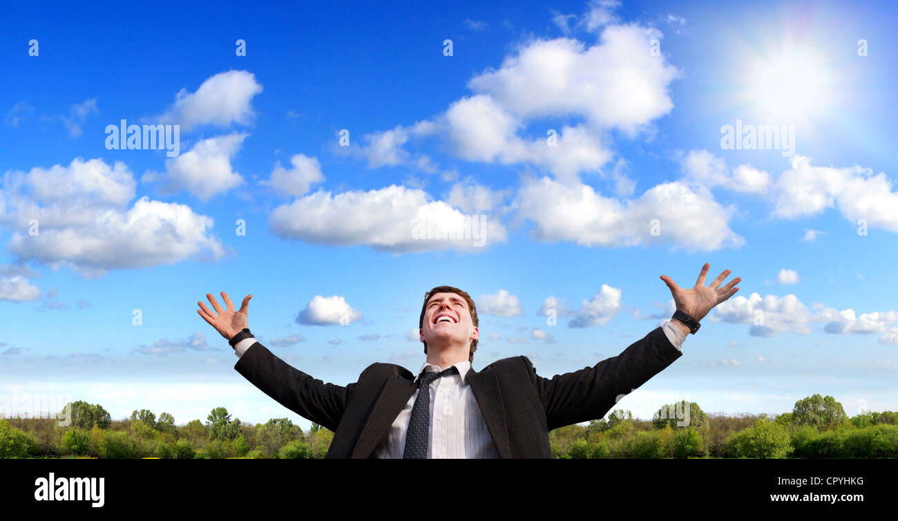 Happy young man and beautiful day alone on the meadow Stock Photo - Alamy