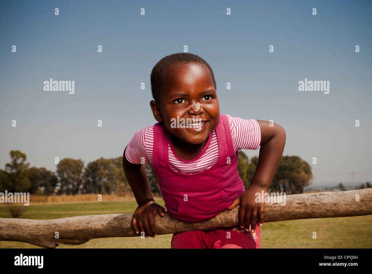Young African girl at her rural home, smiling Stock Photo - Alamy