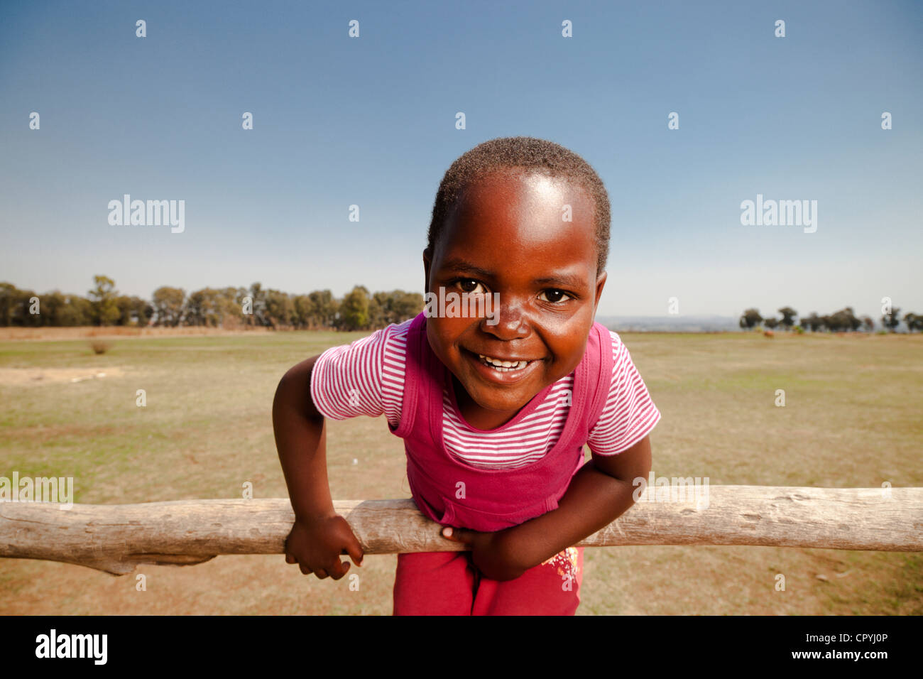 Young African girl at her rural home, smiling Stock Photo - Alamy