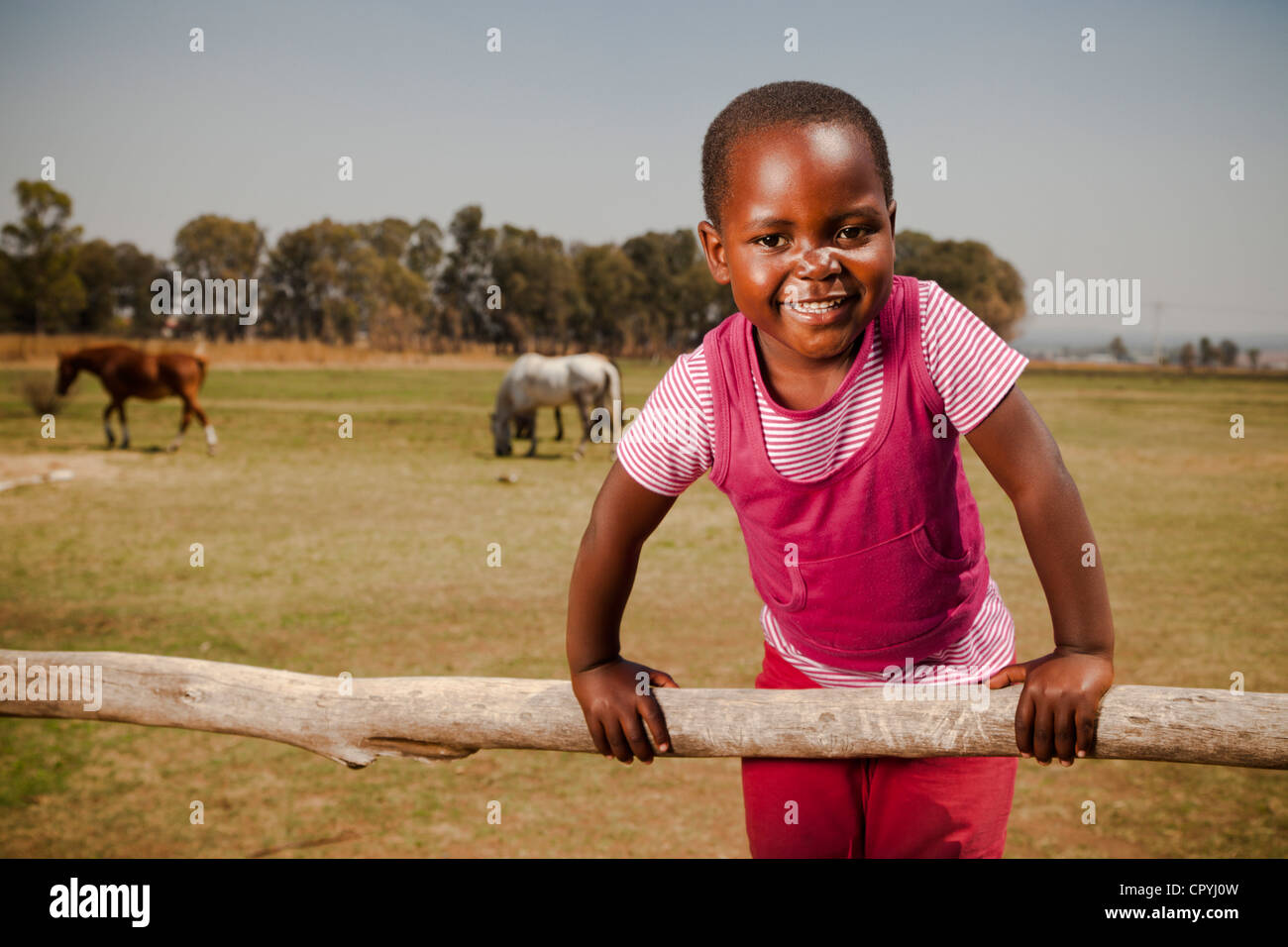 Young African girl at her rural home, smiling Stock Photo - Alamy