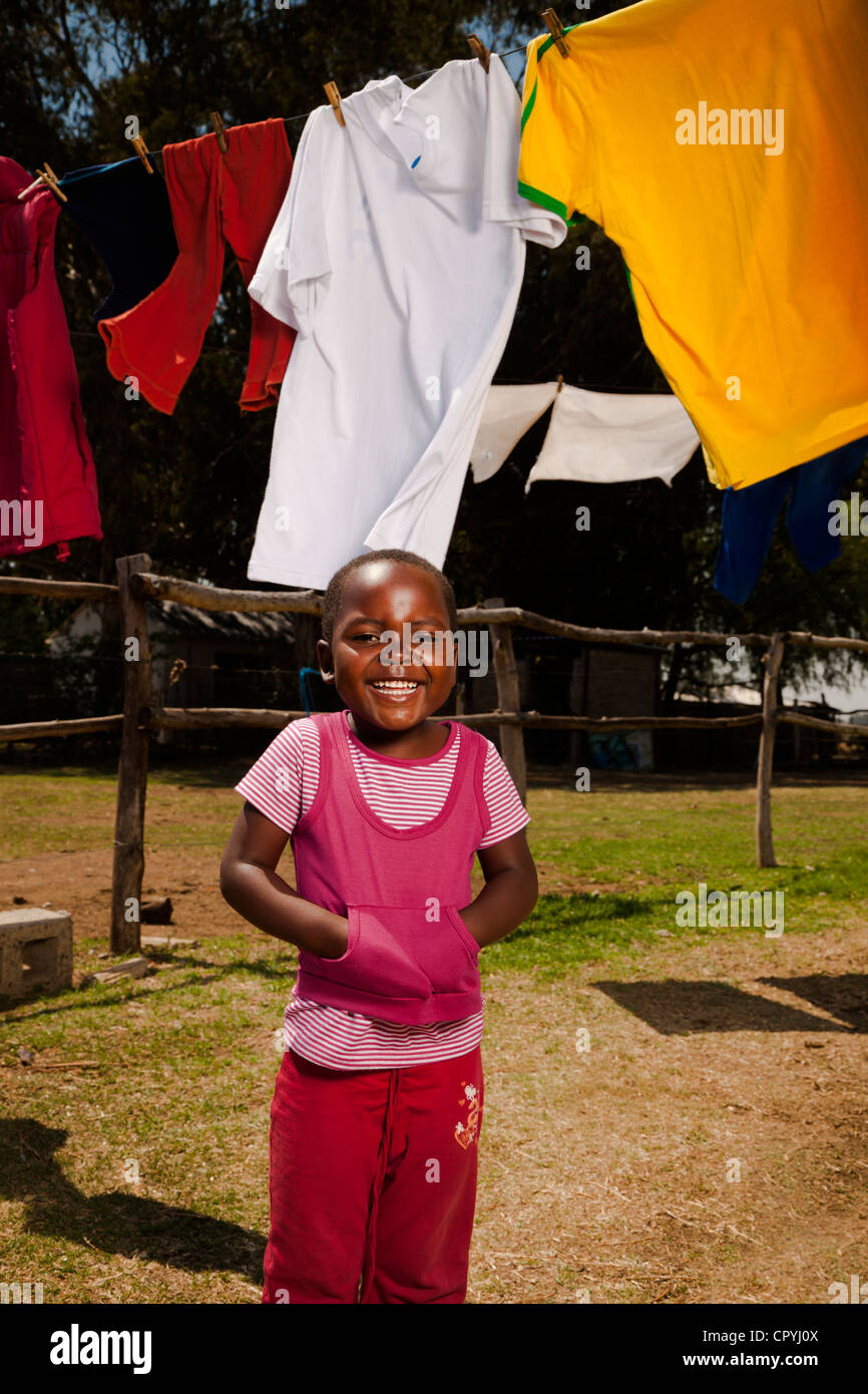 Young African girl at her rural home, smiling Stock Photo - Alamy
