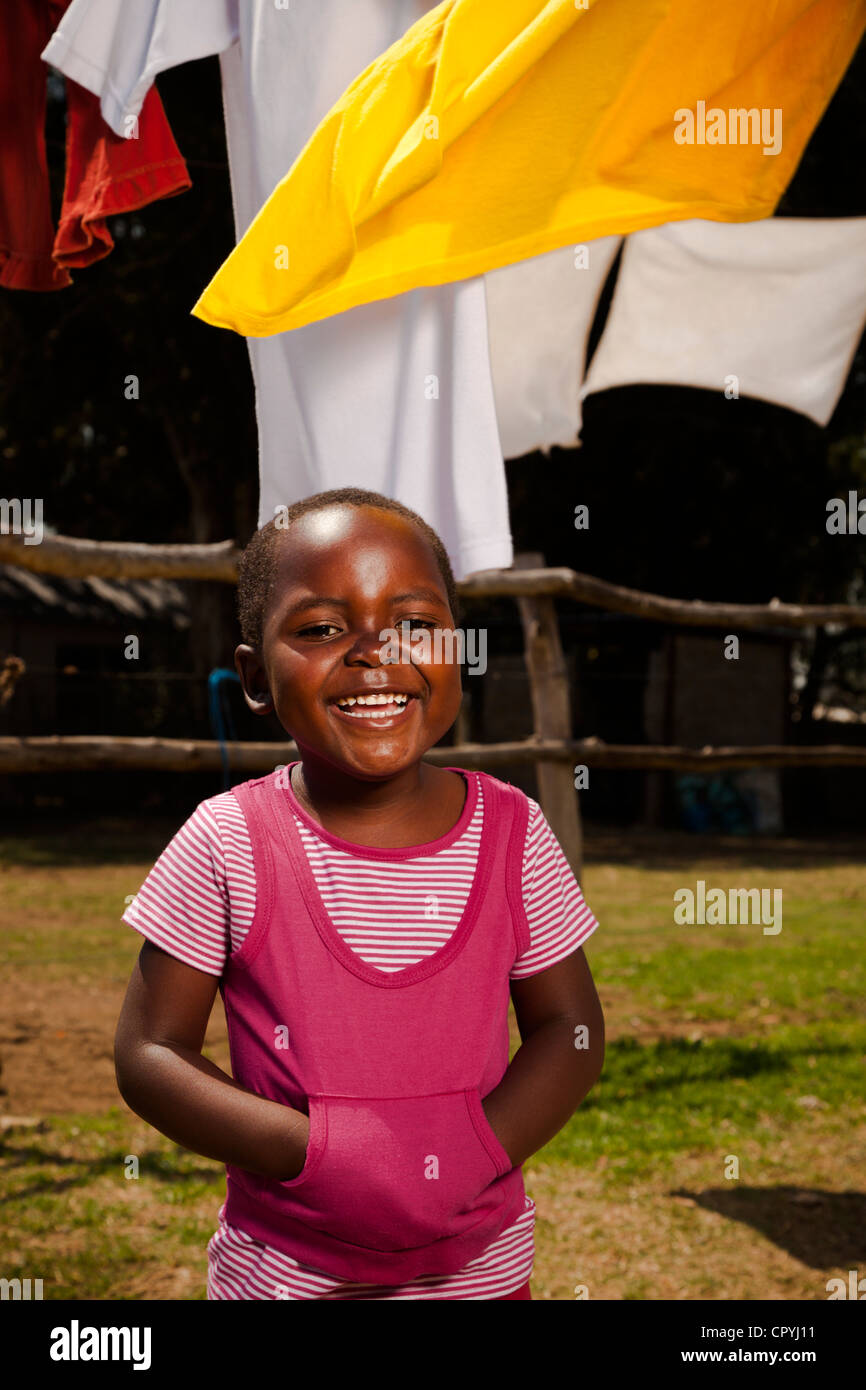 Young African girl at her rural home, smiling Stock Photo - Alamy