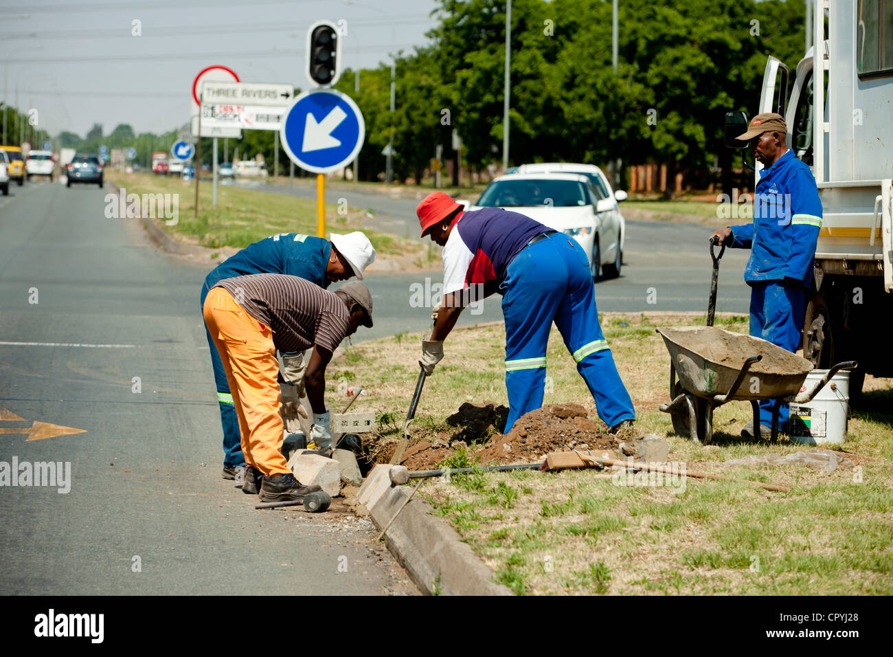 Overalls construction workers group hi-res stock photography and images ...