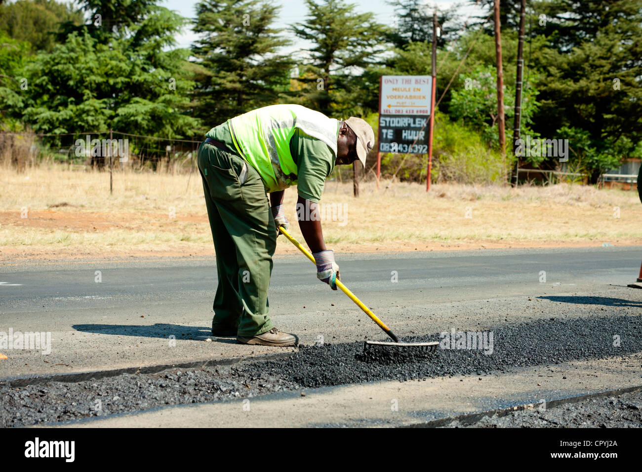 African municipality workers work on a roadside Stock Photo - Alamy