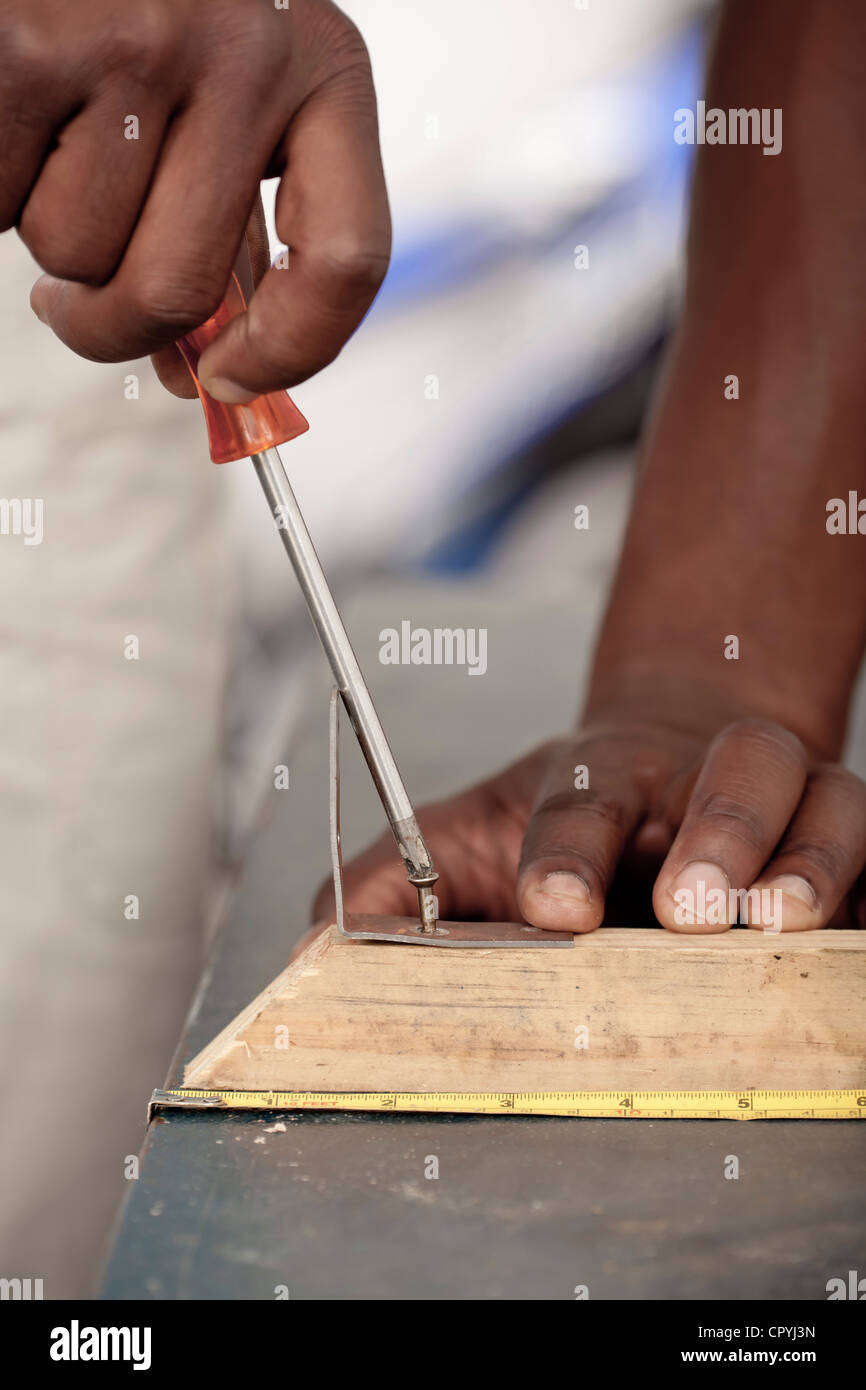 African person screwdriver hi-res stock photography and images - Alamy