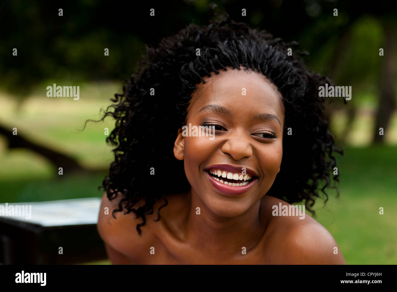 Closeup portrait of young black woman smiling Stock Photo - Alamy