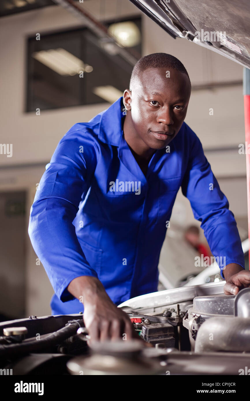 African man working on a car engine Stock Photo - Alamy