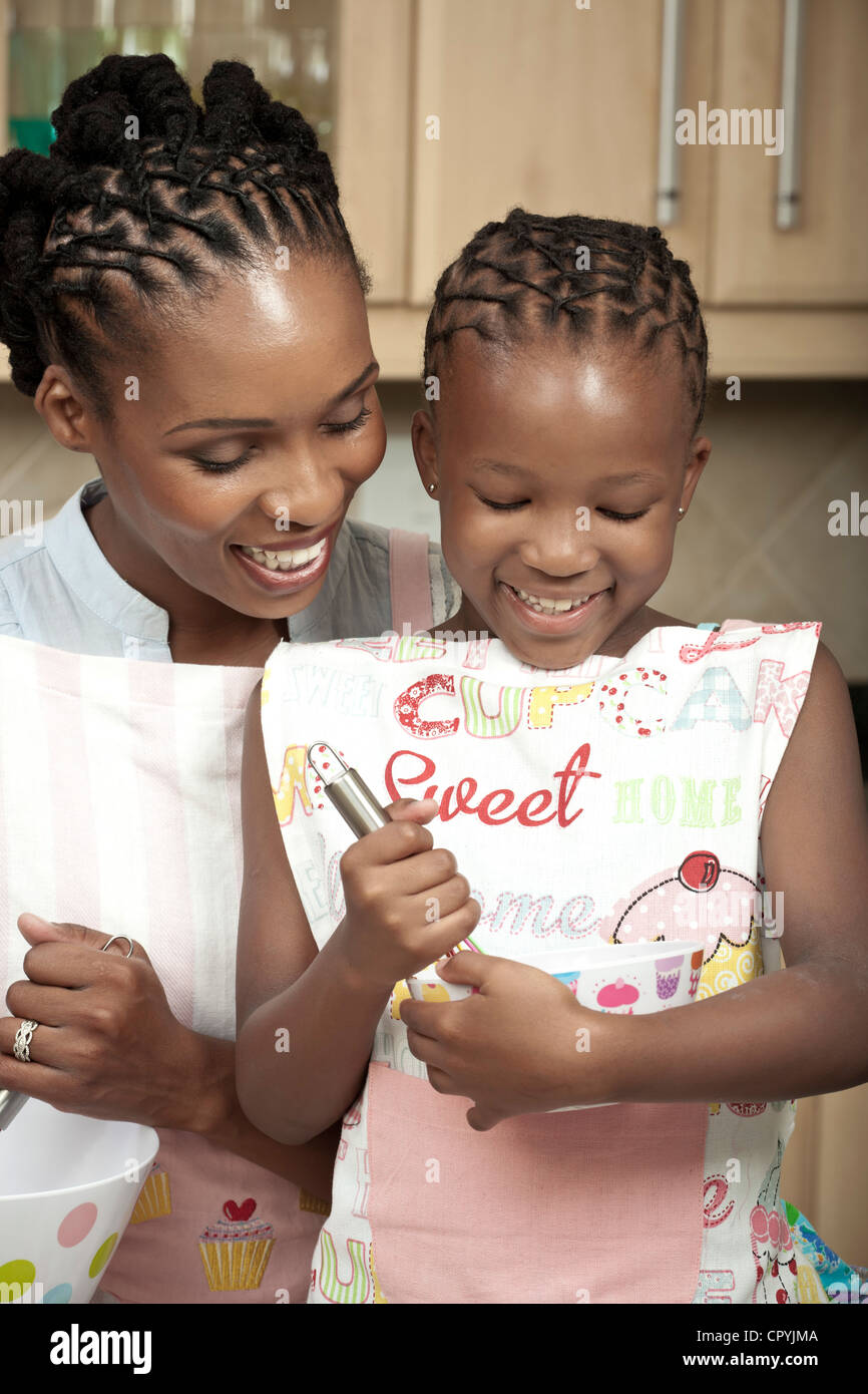Black woman mixing baking hi-res stock photography and images - Alamy
