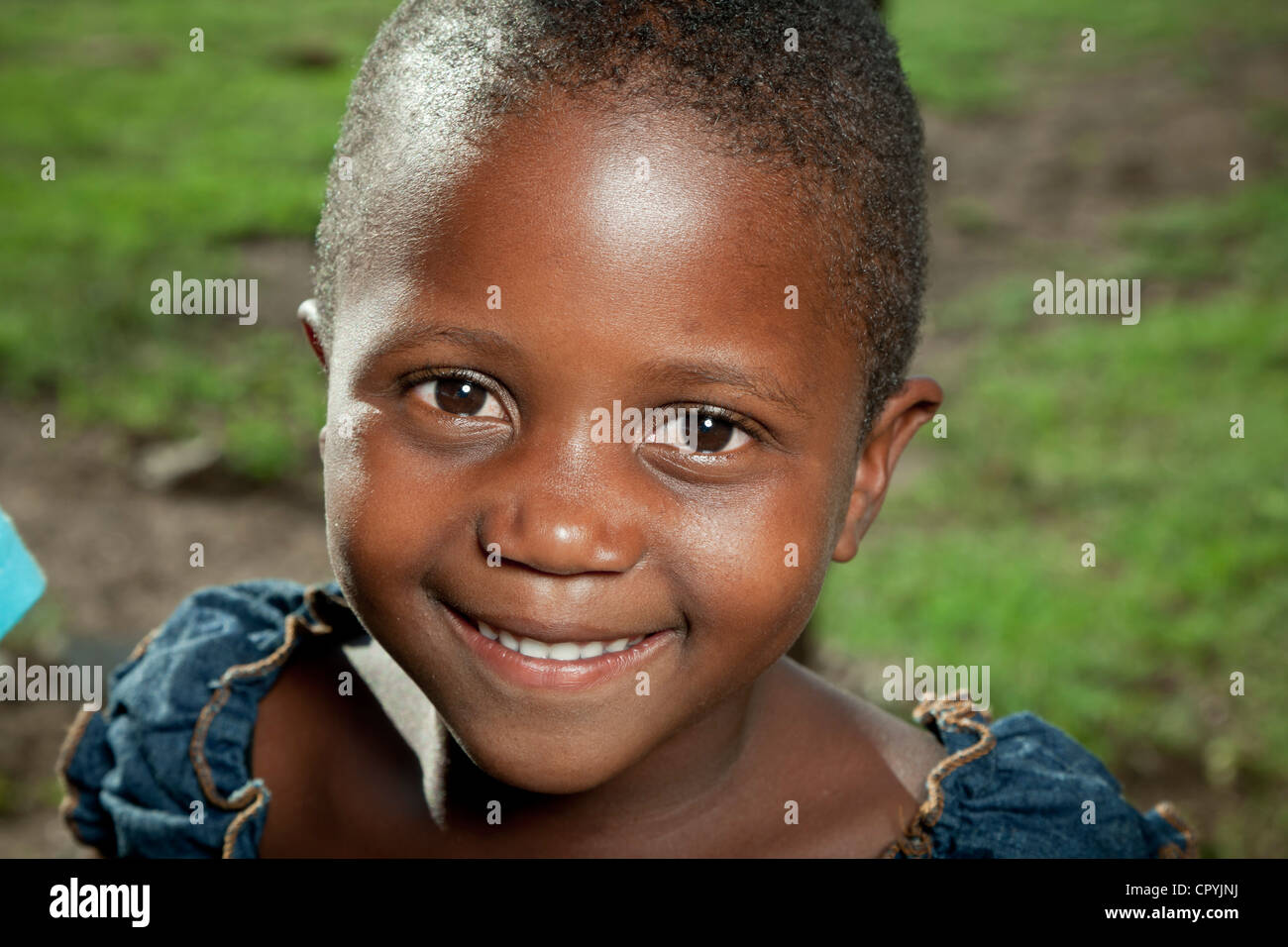 A closeup portrait of a female African child, smiling at camera Stock ...