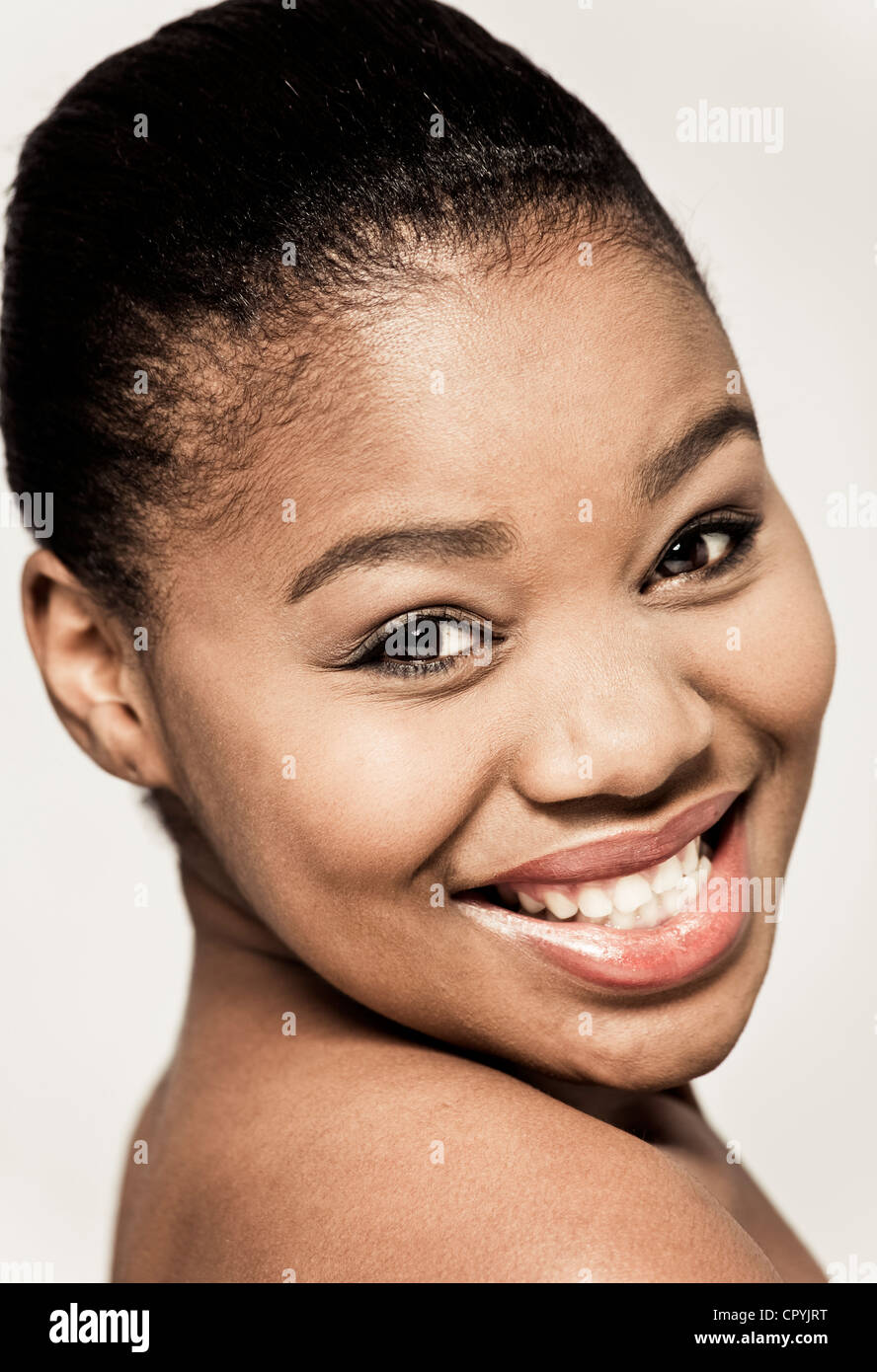 Closeup of black female making eye contact with camera hi-res stock ...