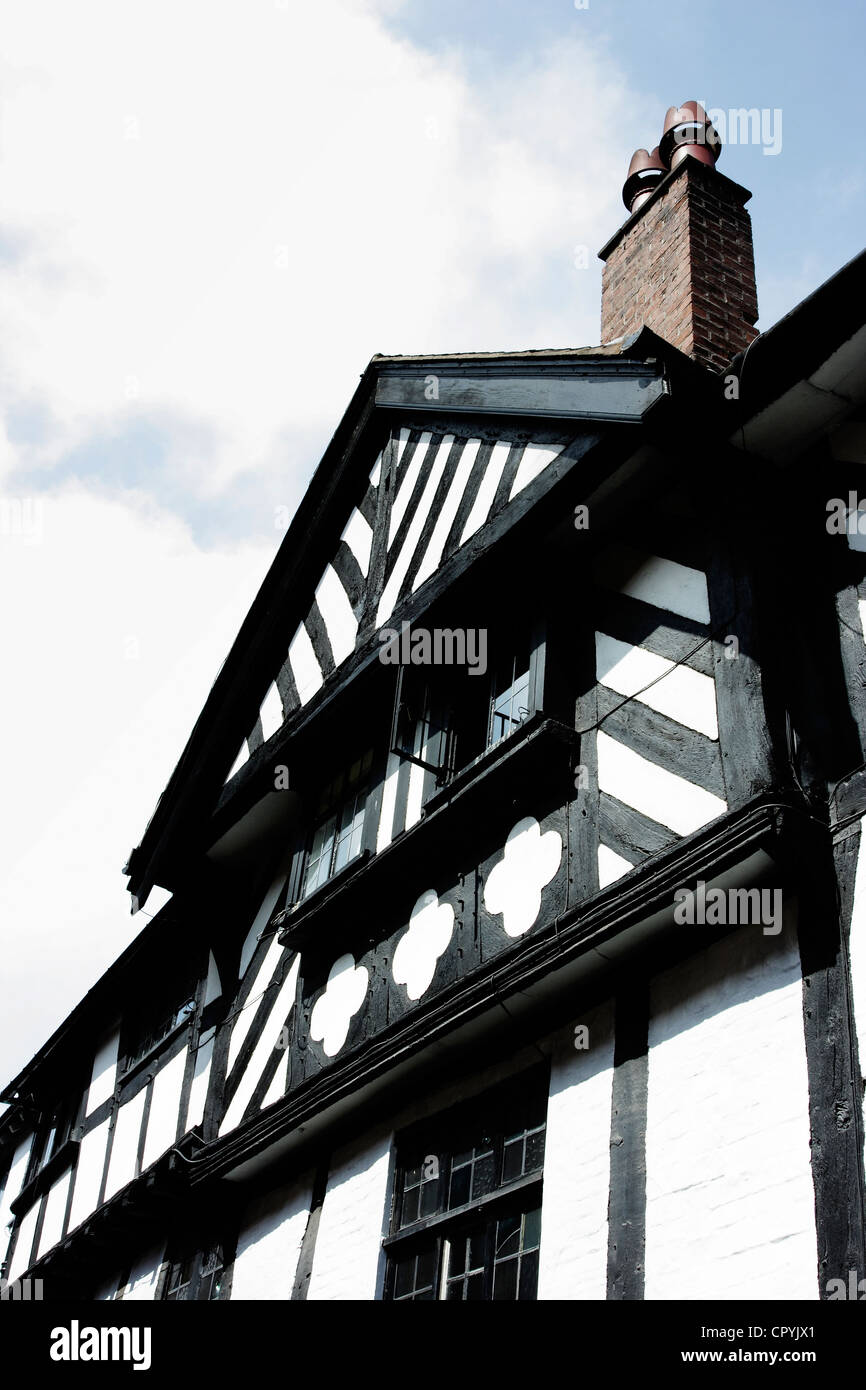 A Tudor half-timbered building with the wooden beams painted black ...