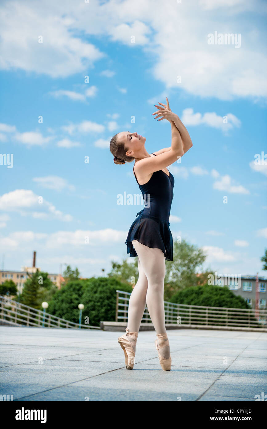 Ballet dancer dancing outdoor with blue sky in background Stock Photo ...