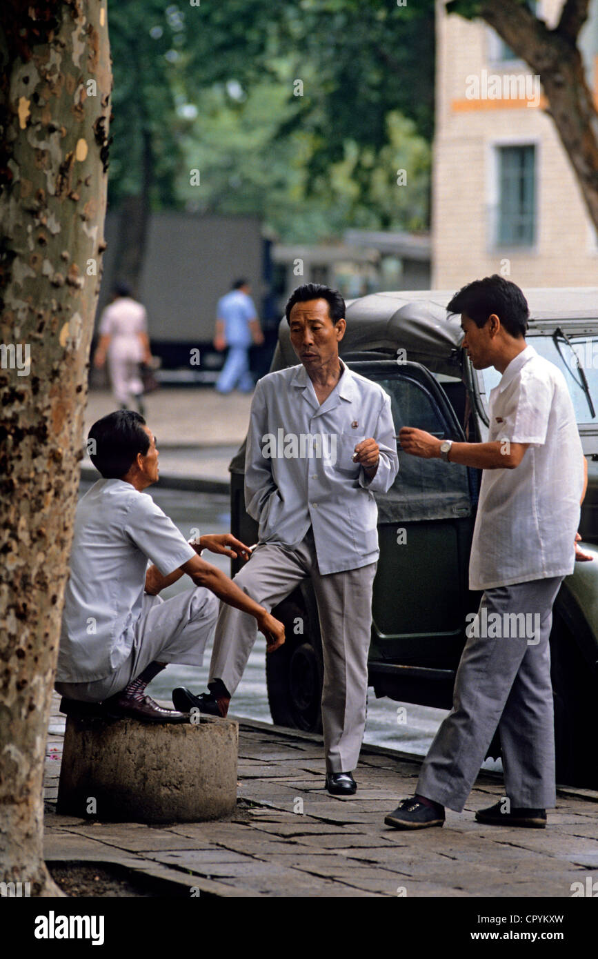 North Korea, Pyongyang, men talking in the street Stock Photo - Alamy