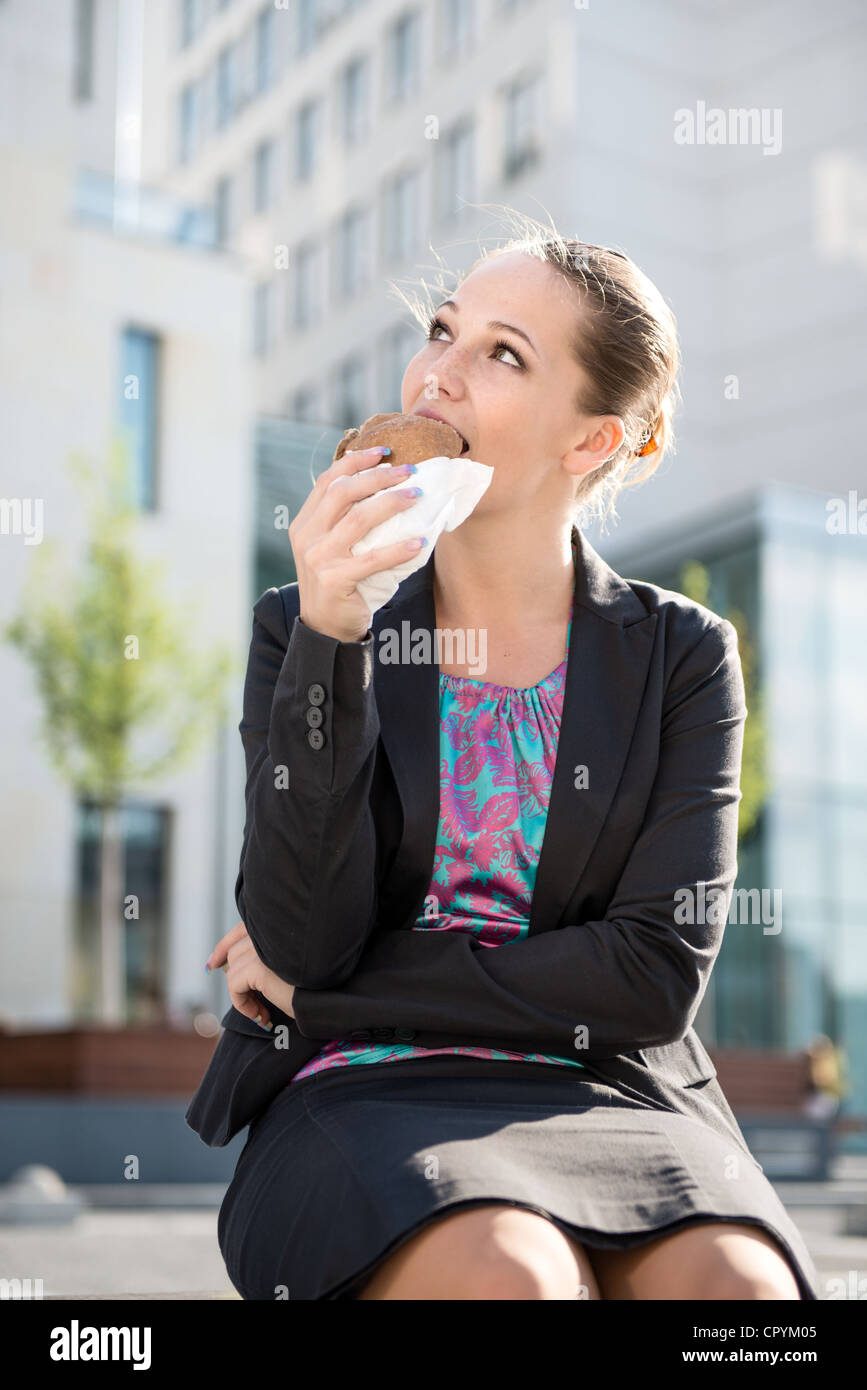 One businesswoman eating lunch outside hi-res stock photography and ...