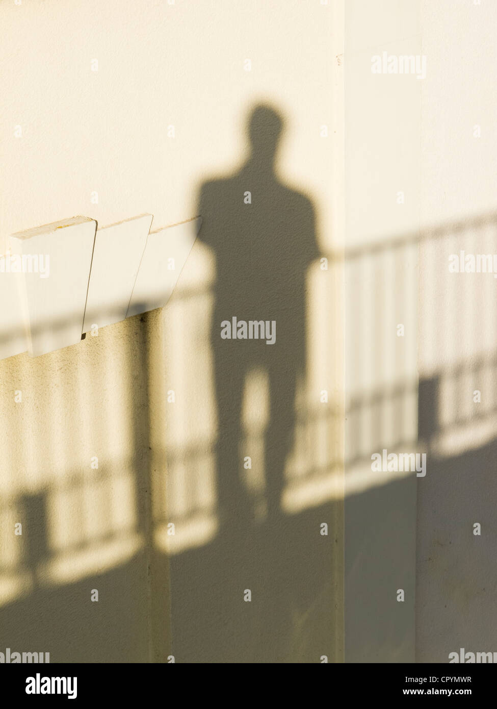Man's shadow in winter sunshine Stock Photo - Alamy