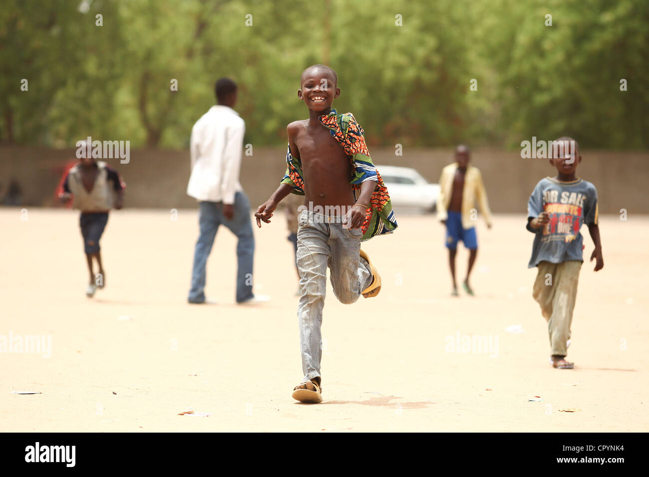 A boy runs towards the camera in N'Djamena, Chad on Tuesday June 8 ...