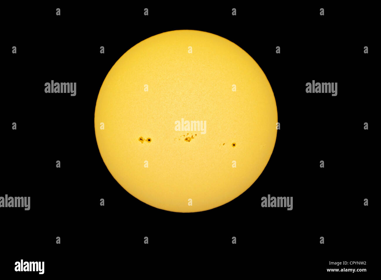 Sun with solar spots in the white light, yellow filter Stock Photo - Alamy
