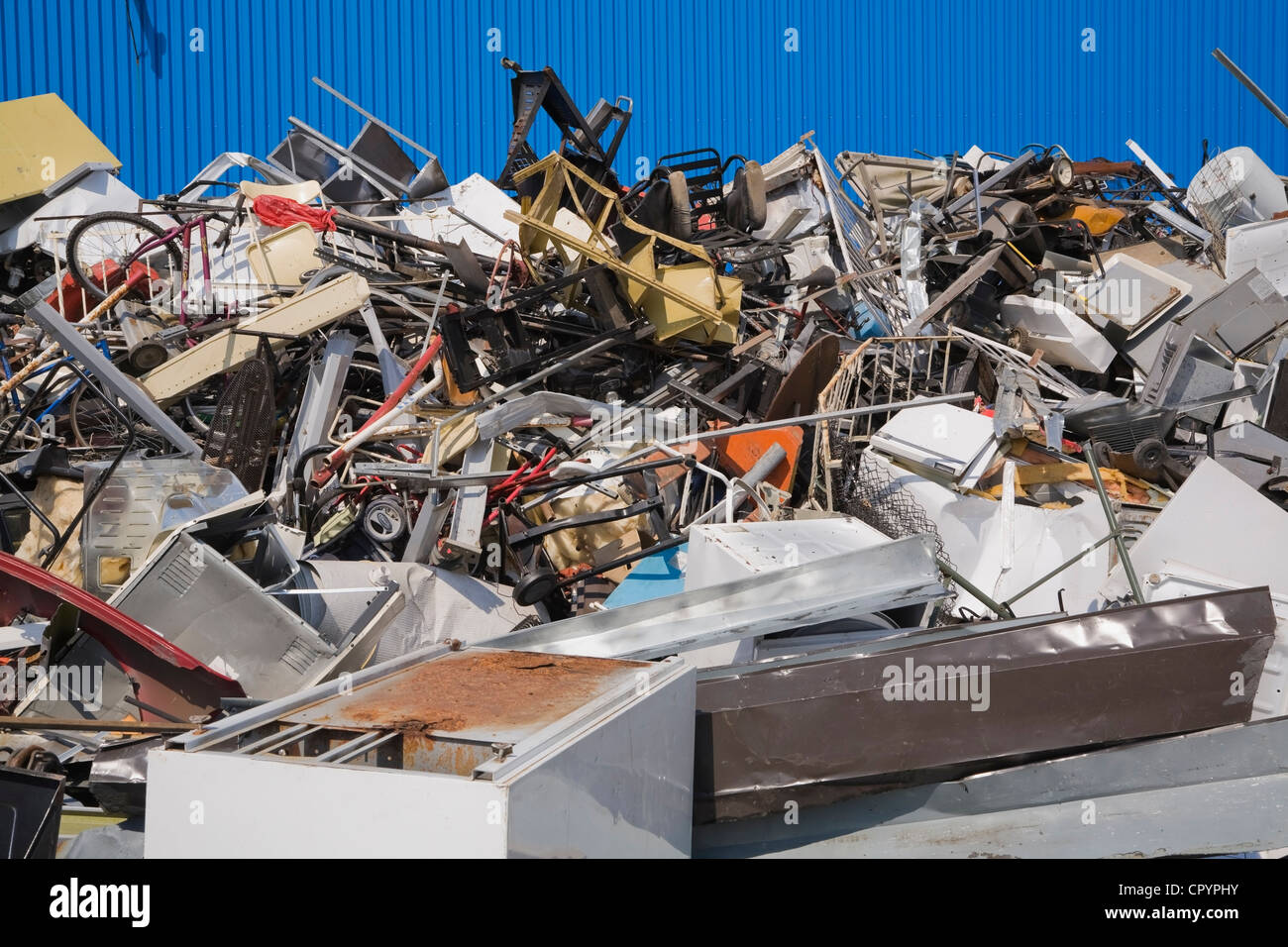 Pile of discarded household and industrial items at a scrap metal ...